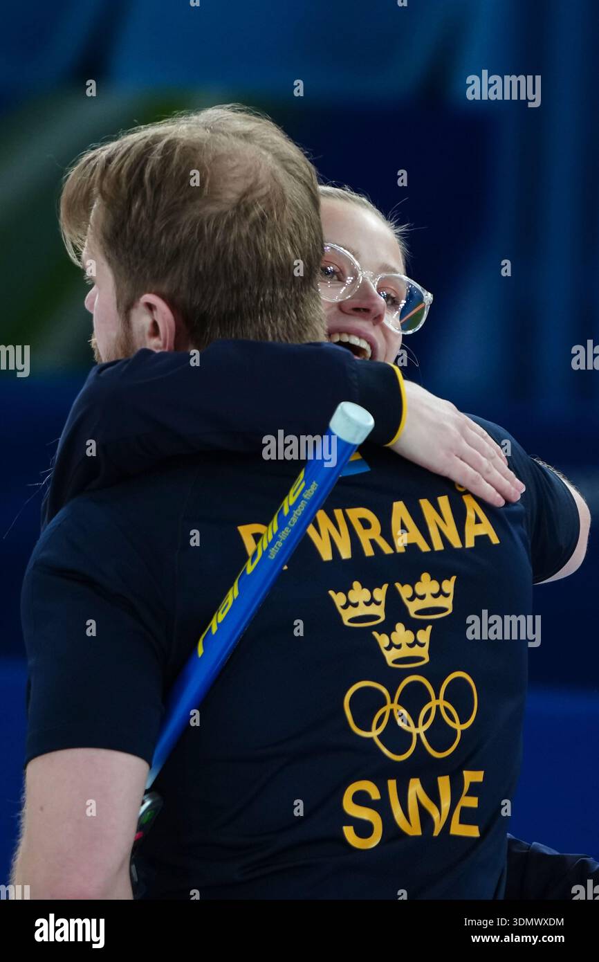 Sweden's Isabella Wranaa and Rasmus Wranaa hug during the mixed doubles ...