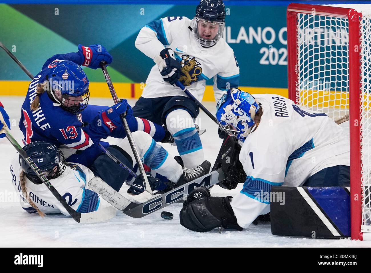 Finland's Sanni Ahola, right, makes a save against United States' Grace ...
