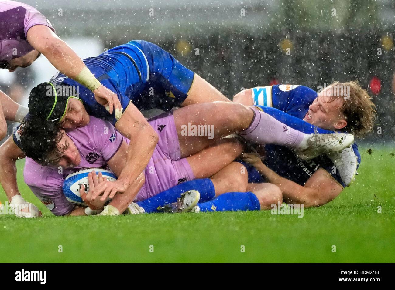 Scotland's Tom Jordan, bottom, and Italy's Juan Ignacio Brex and ...
