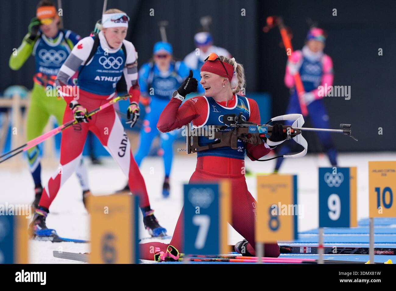 Amy Baserga, of Switzerland, gestures as she participates in a biathlon ...