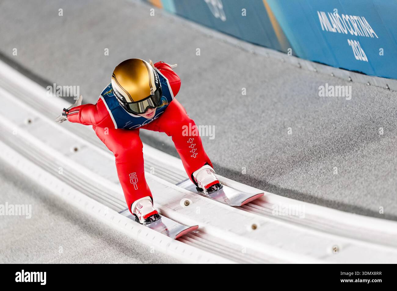 Sina Arnet, of Switzerland, goes down the ramp during her trial jump of ...