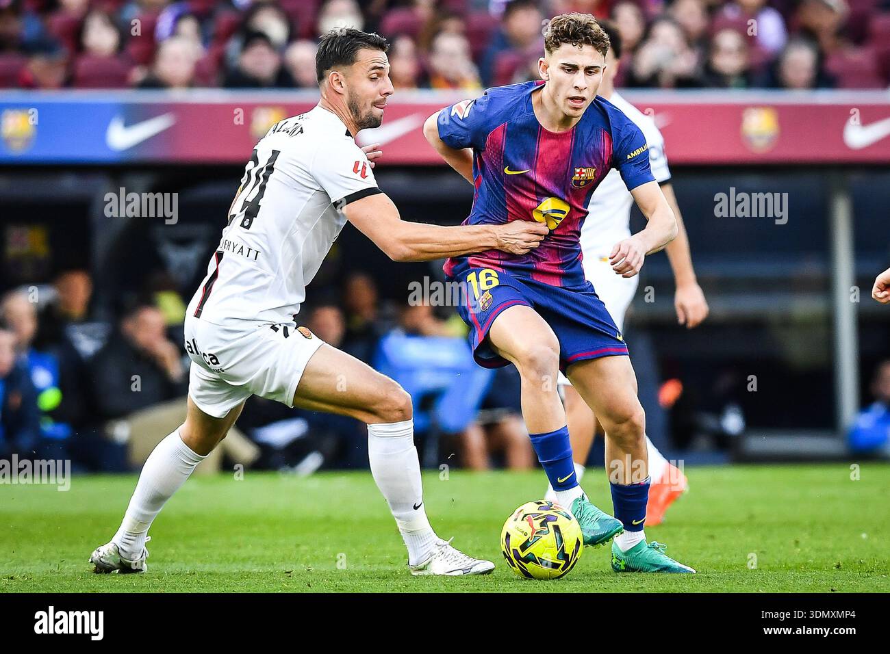 Martin VALJENT of RCD Mallorca and Fermin LOPEZ of Barcelona during the ...