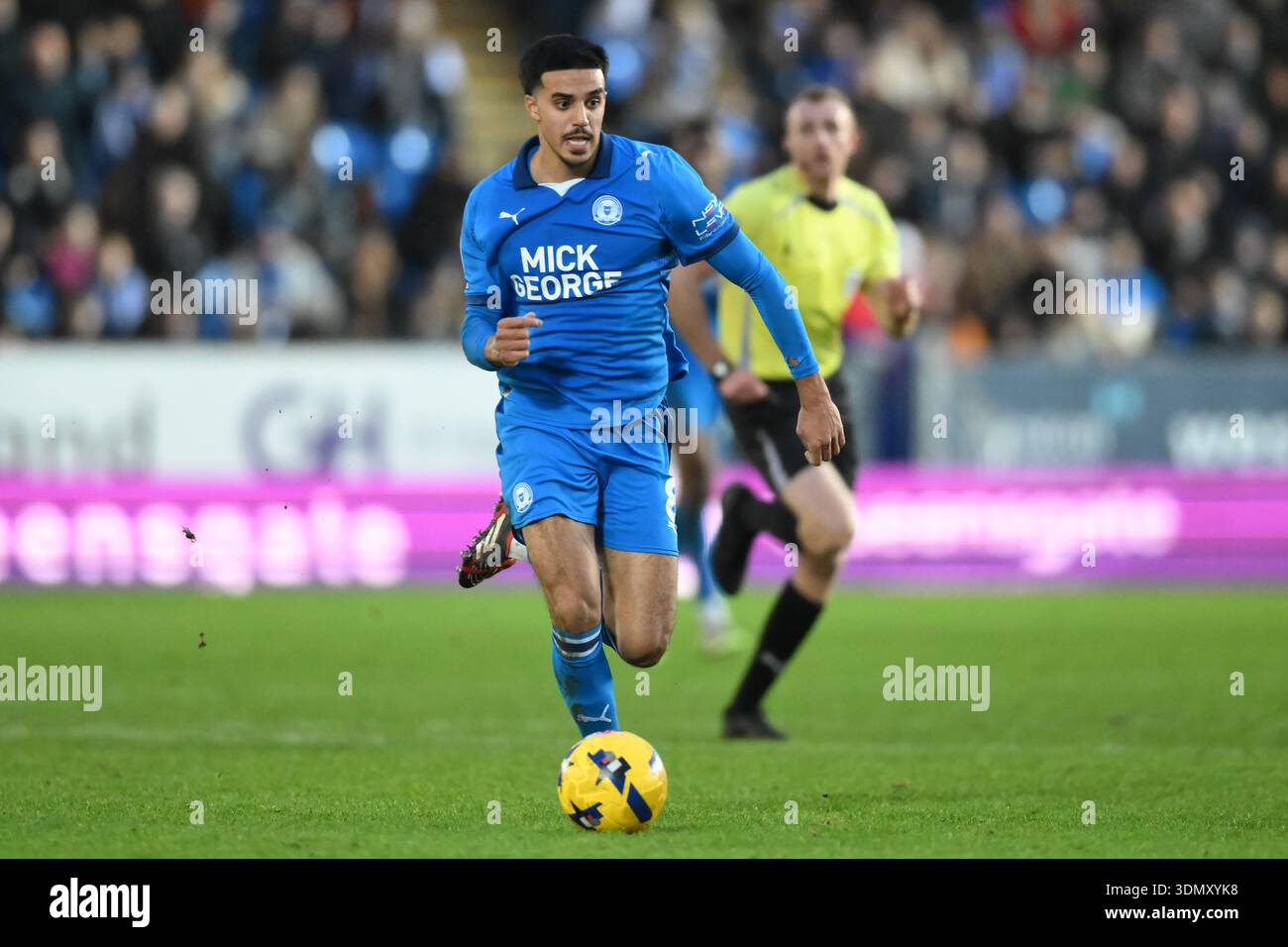 Brandon Khela of Peterborough United goes forward with the ball during ...