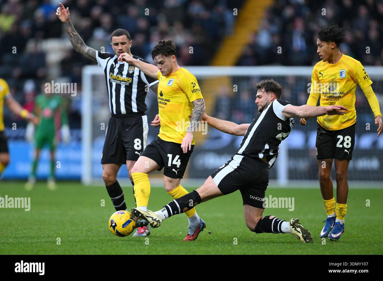 Matthew Platt of Notts County tackles Charlie McCann of Barrow during ...