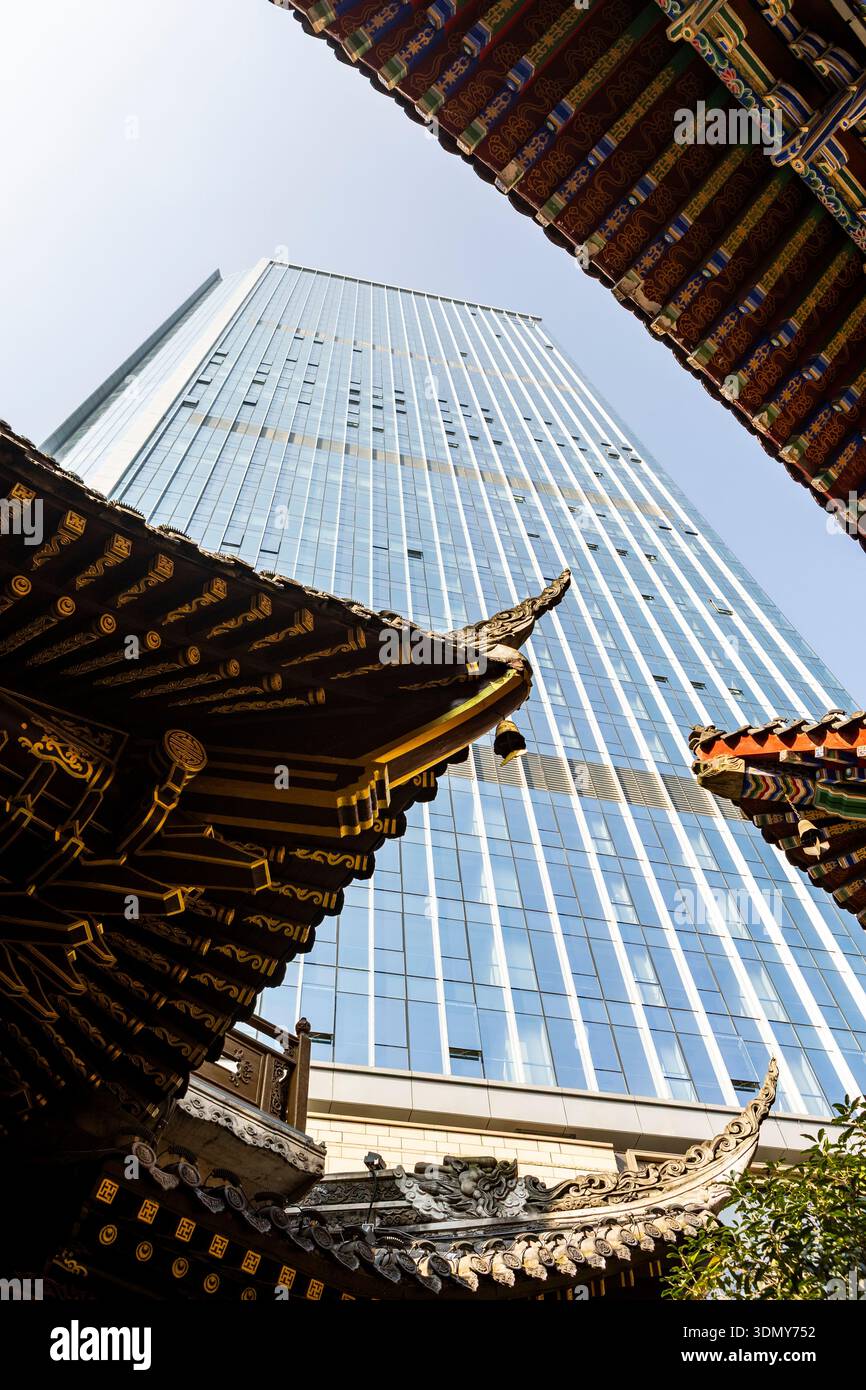 The striking image captures a modern skyscraper juxtaposed against ...