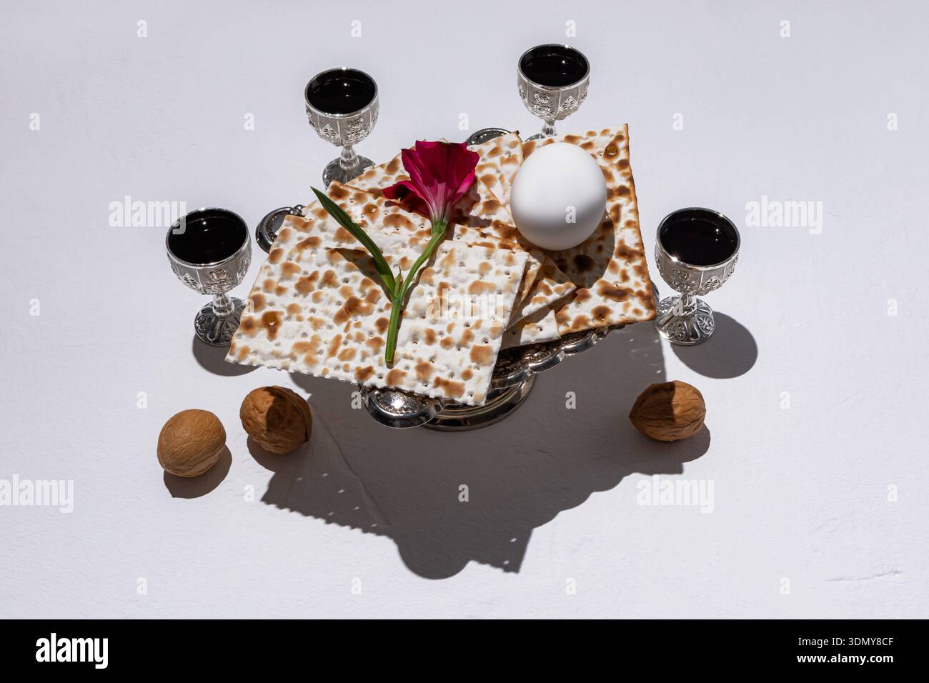 The image showcases traditional Passover symbols including matzah, an ...
