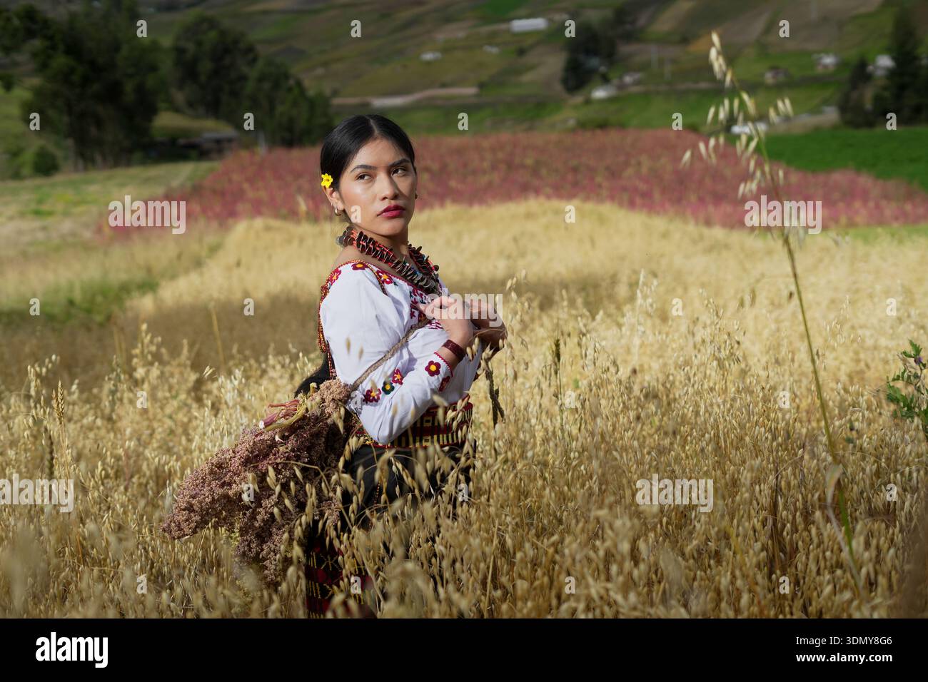 Puruwa indigenous woman in traditional attire standing in a golden ...