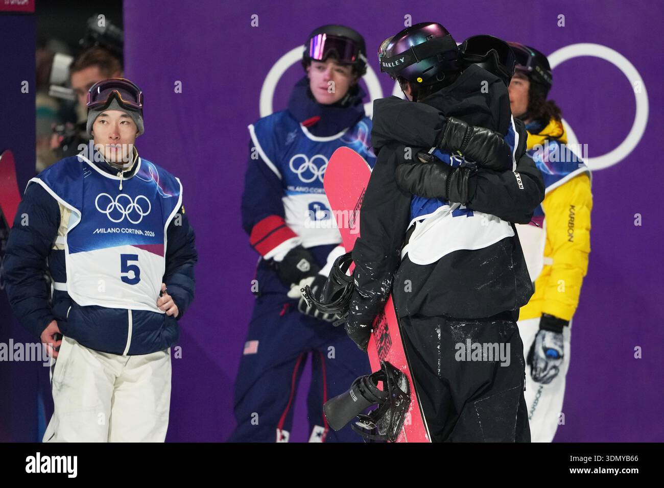 New Zealand's Dane Menzies, left, hugs New Zealand's Lyon Farrell ...