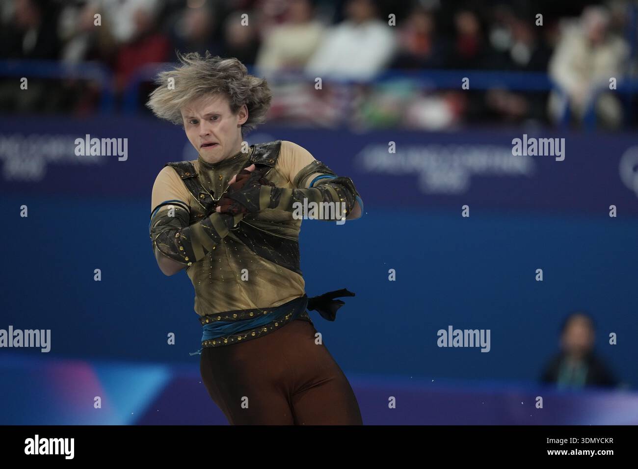Ilia Malinin of the United States warms up before competing during the ...