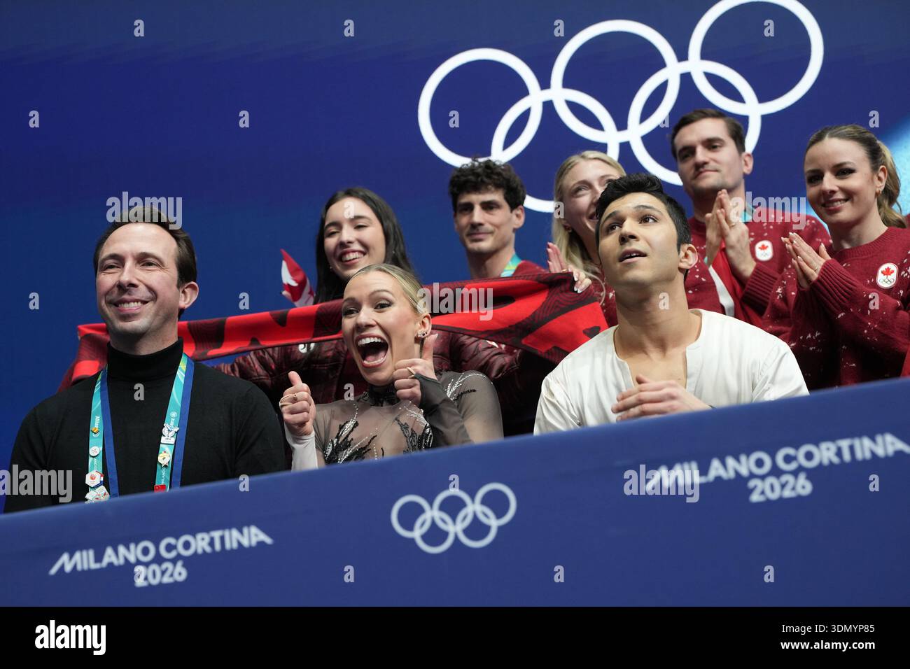 Marjorie Lajoie and Zachary Lagha of Canada react to their scores after ...