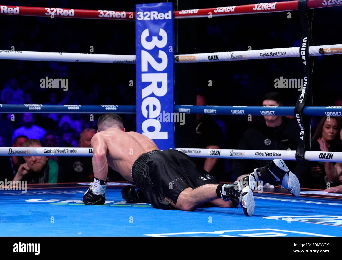 Nick Ball reacts after being knocked out in the feather weight bout at ...
