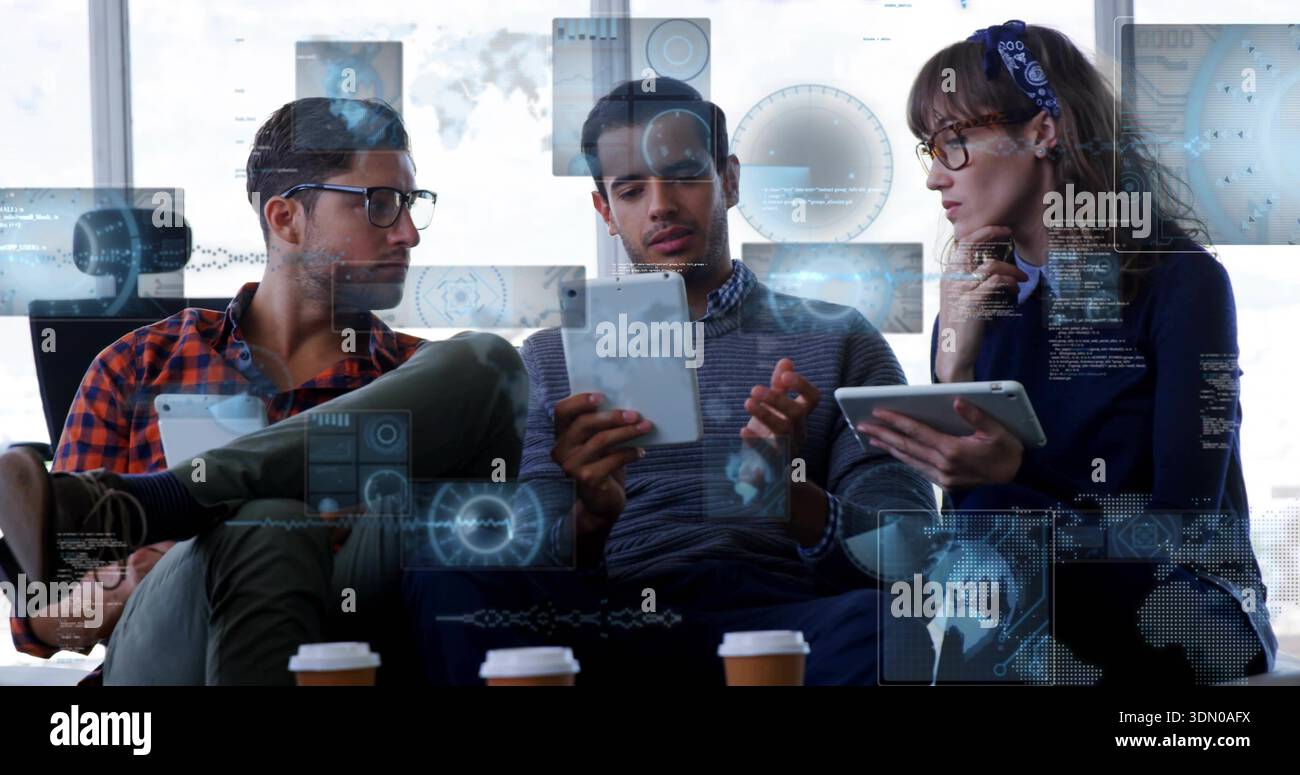 Viewing HUD overlays, team in checked shirt using tablets with cups ...