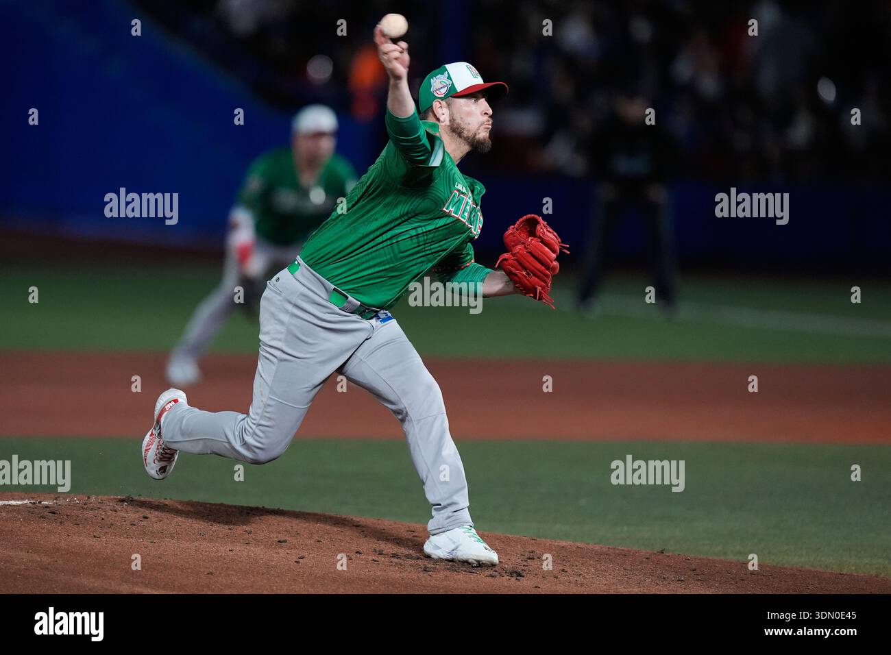 Mexico Green's starting pitcher Wilmer Rios throws against Mexico Red ...