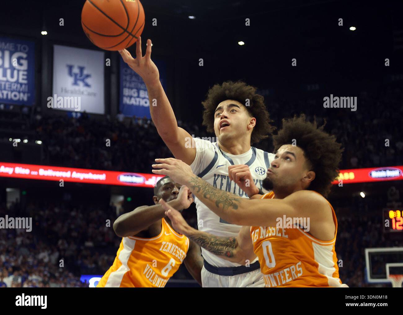 Kentucky's Malachi Moreno, center, loses the ball between Tennessee's ...