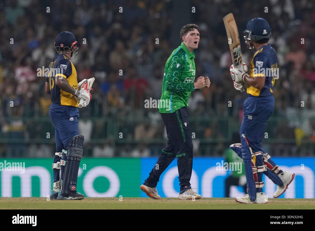 Ireland's Gareth Delany, center, celebrates the wicket of Sri Lanka's ...