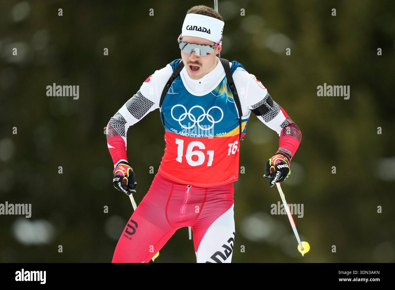 Adam Runnalls, of Canada, competes in the 4X6-kilometer mixed relay ...