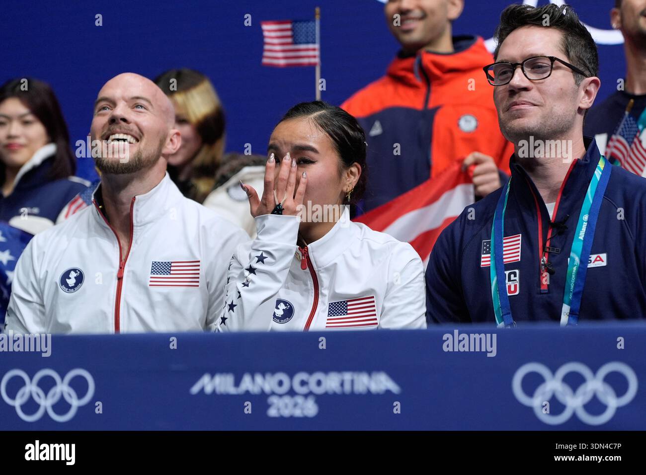 Ellie Kam and Danny O'Shea of the United States reacts to their scores ...