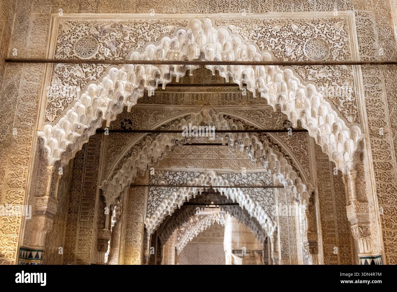 Repeating Moorish arches and carved details create depth and symmetry ...