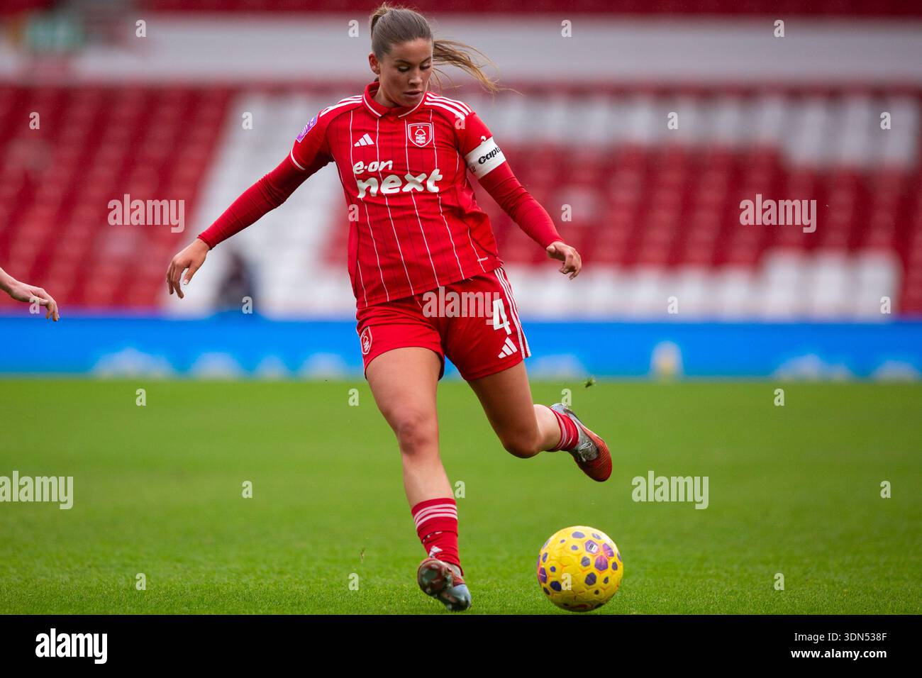Georgia Brougham (4 Nottingham Forest) passes the ball backwards ...