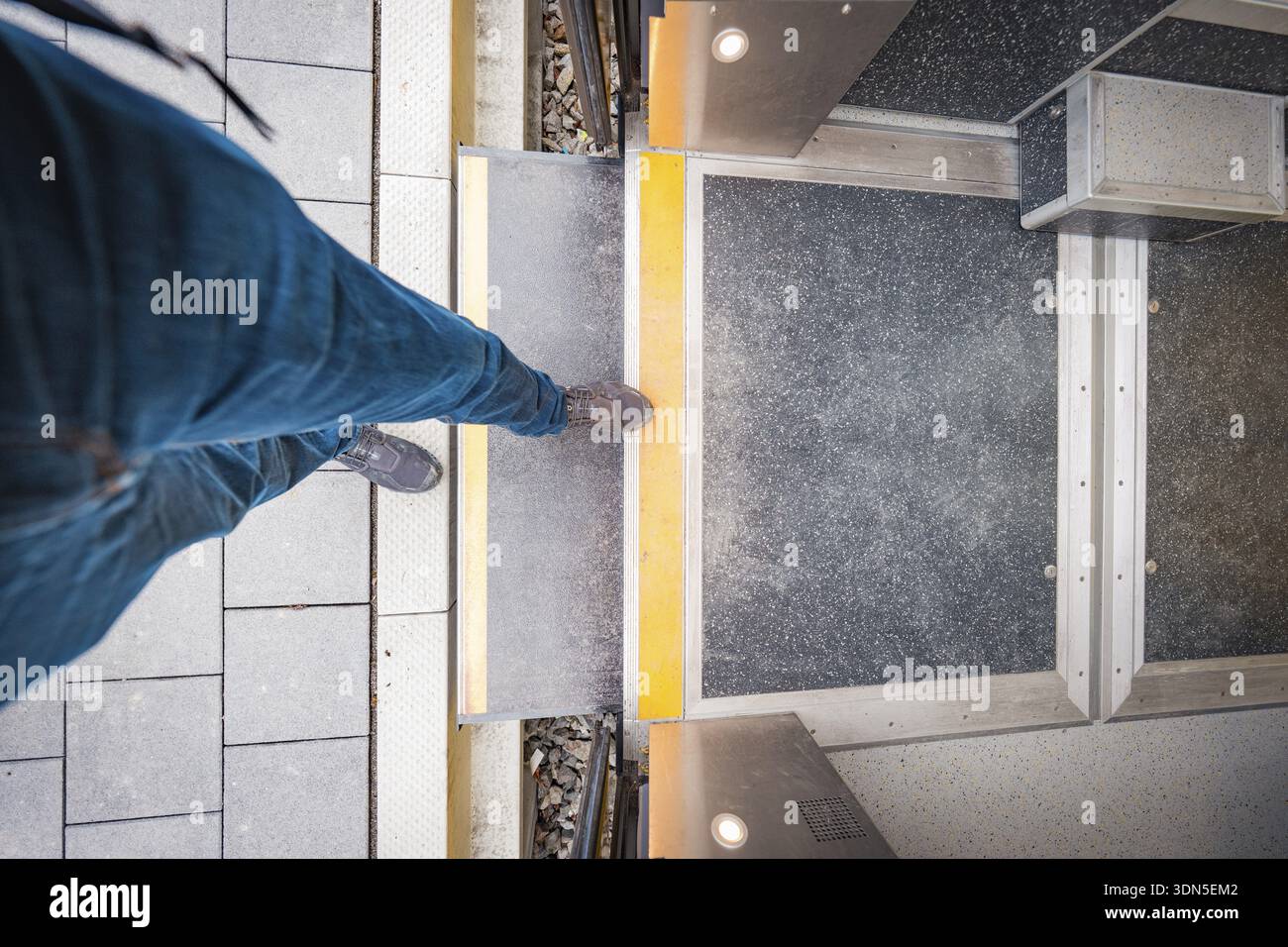 Person boarding a train, view from above of the entrance, Siemens Micro ...