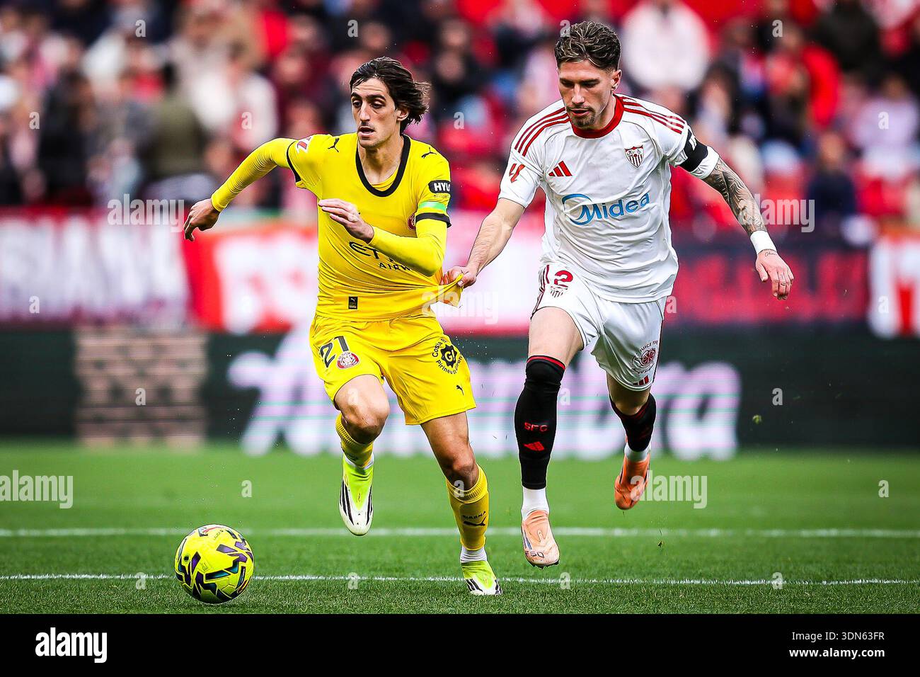 Bryan GIL of Girona and Jose Angel CARMONA of Sevilla FC during the ...