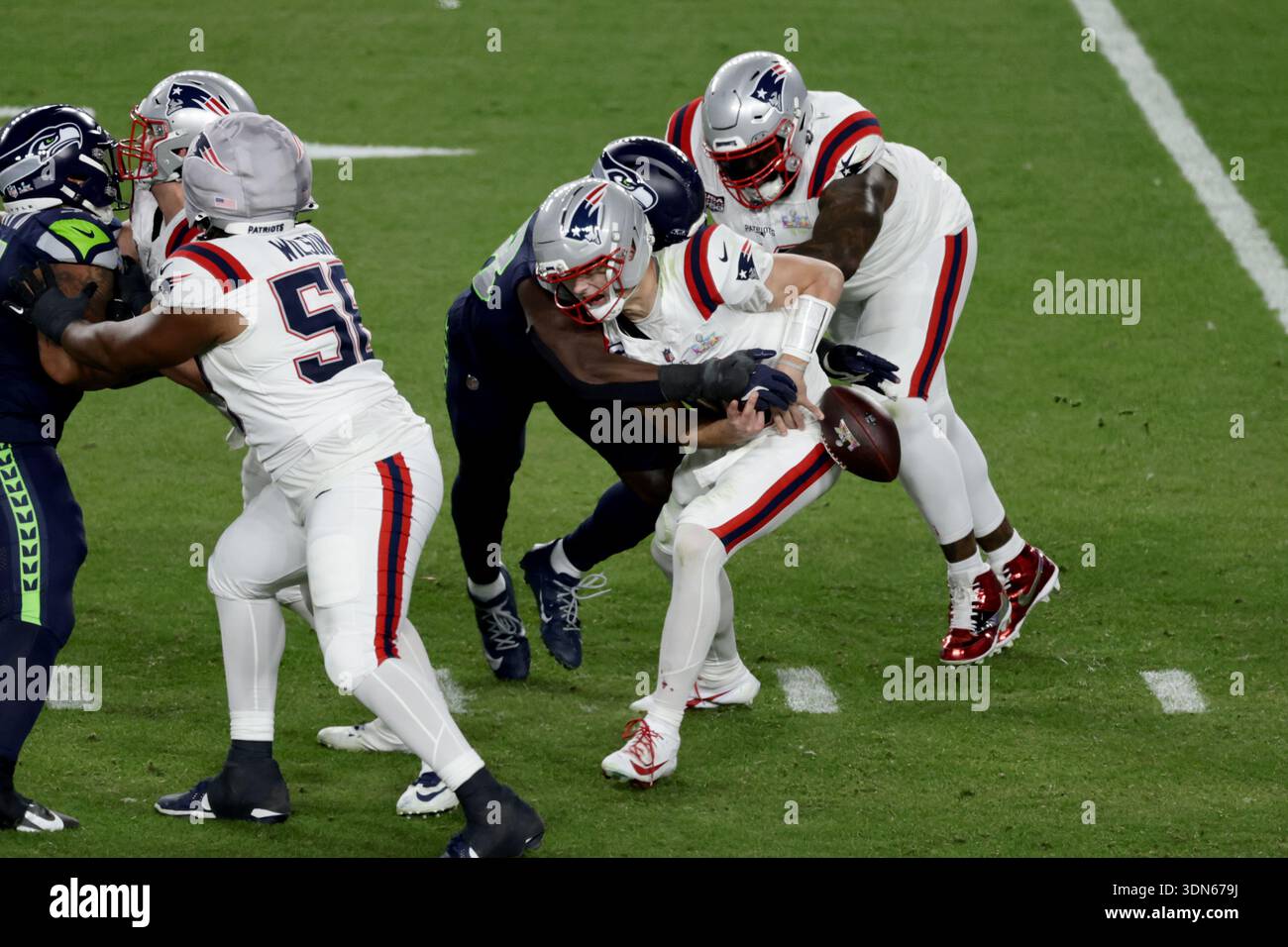 New England Patriots quarterback Drake Maye (10) fumbles after a hit by ...