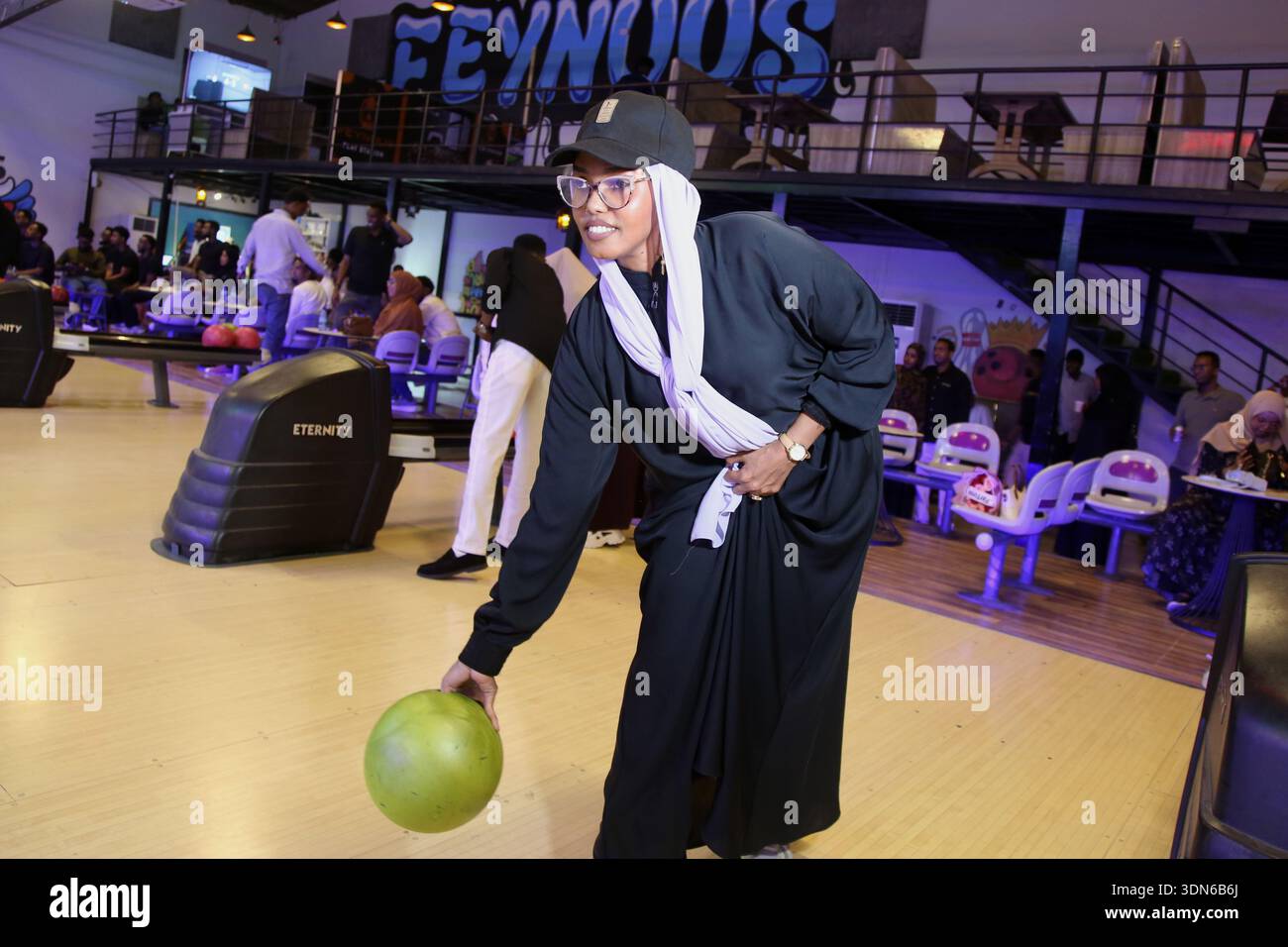 A Somali woman bowls at the Feynuus Bowling Center in Mogadishu ...