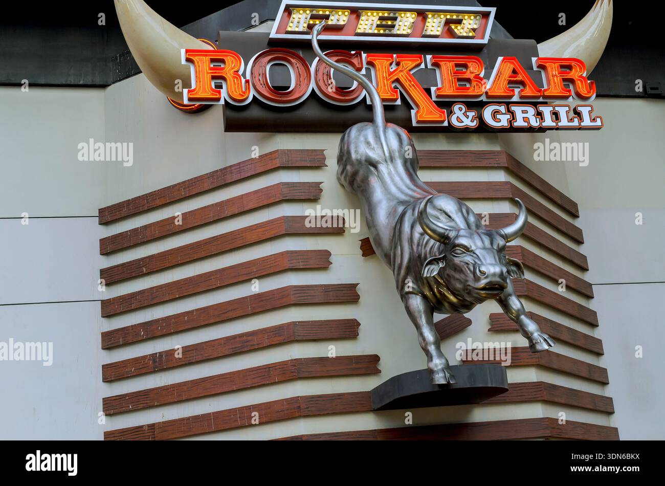 Sign of Rock Bar Grill shows bull sculpture jumping out it is located ...