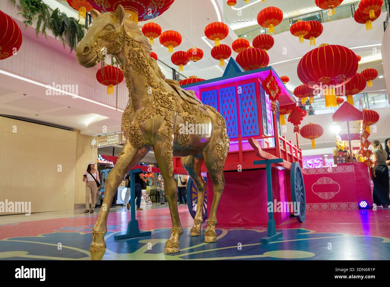 Chinese New Year horse and cart display with red lantern decorations ...