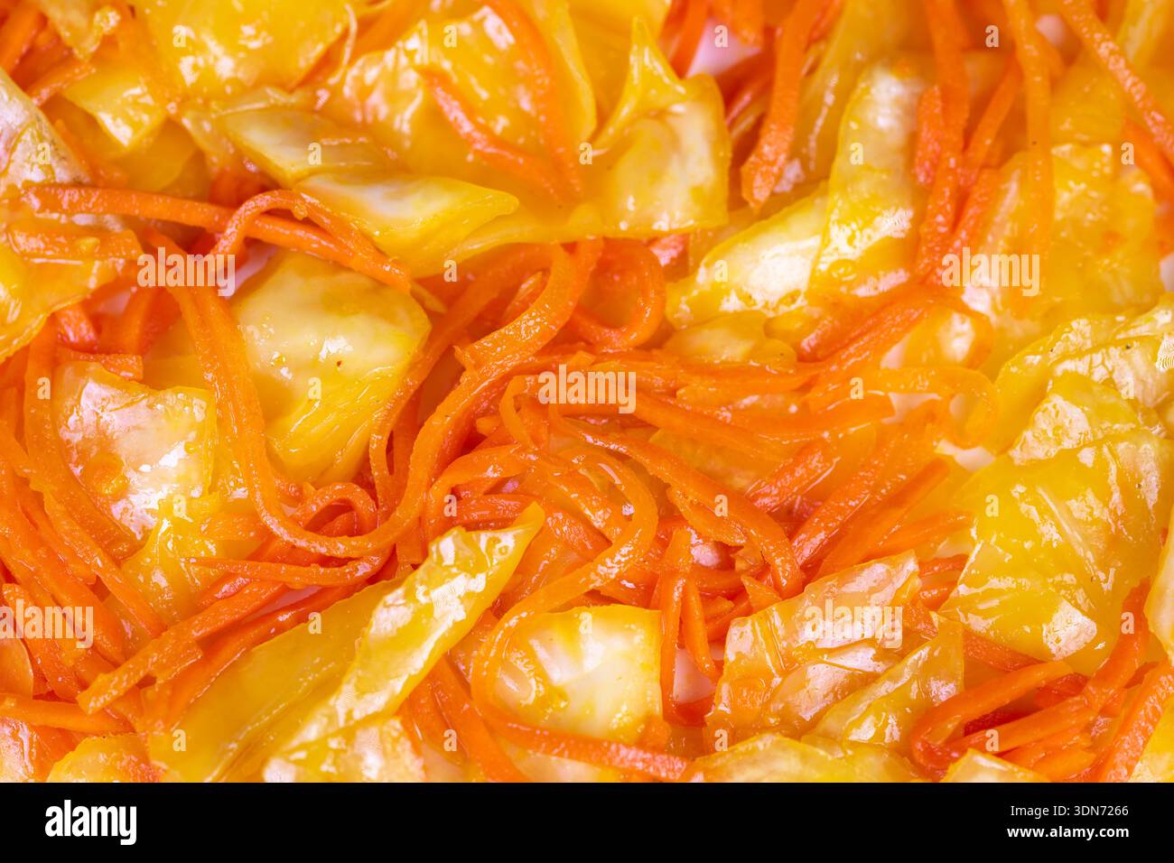 Closeup kimchi pickled carrots cabbage glistening with chili oil, thin ...
