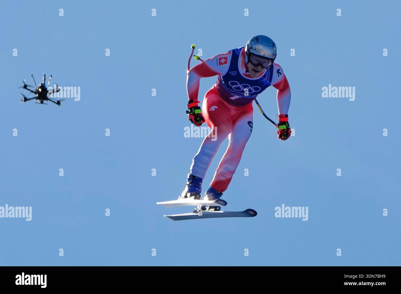 Switzerland's Marco Odermatt, flanked by a drone, speeds down the ...