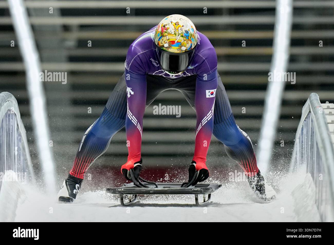 South Korea's Kim Jisoo arrives at the finish during a men's skeleton ...