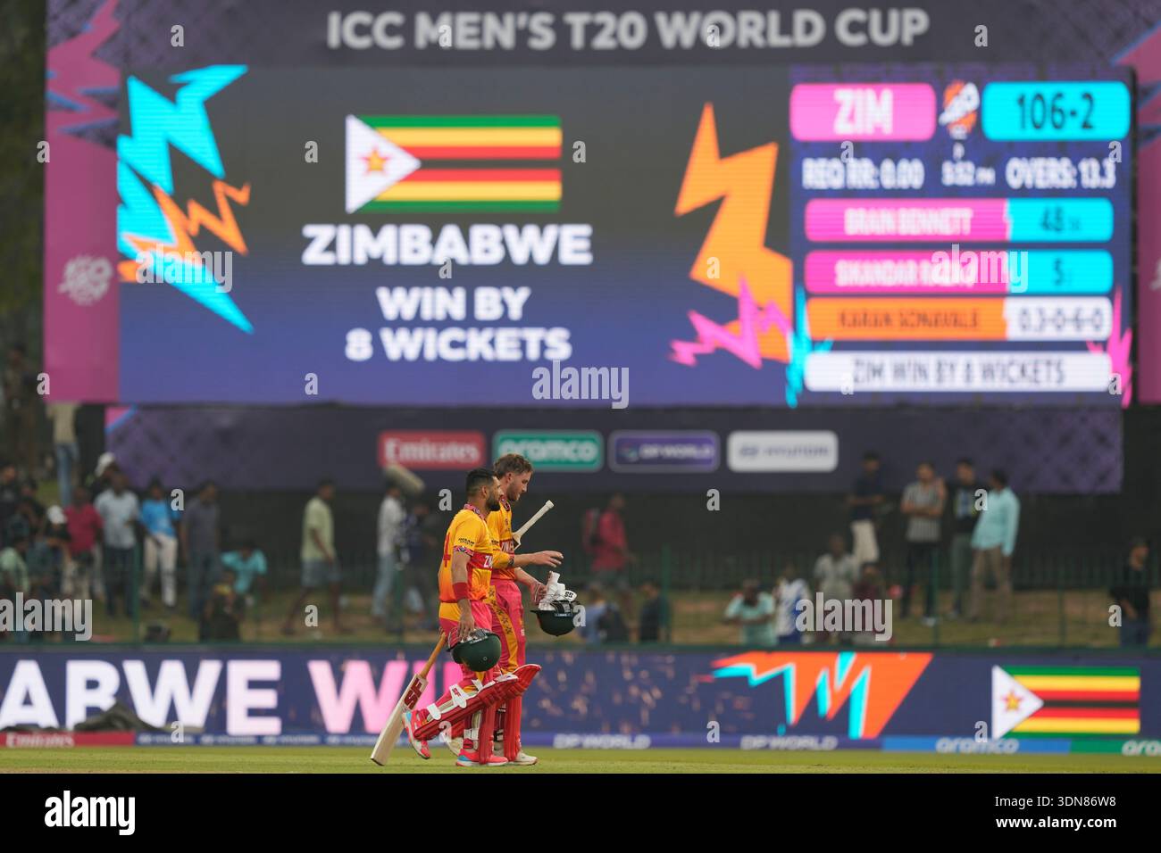 Zimbabwe's captain Sikandar Raza, left, Brian Bennett walks after their ...