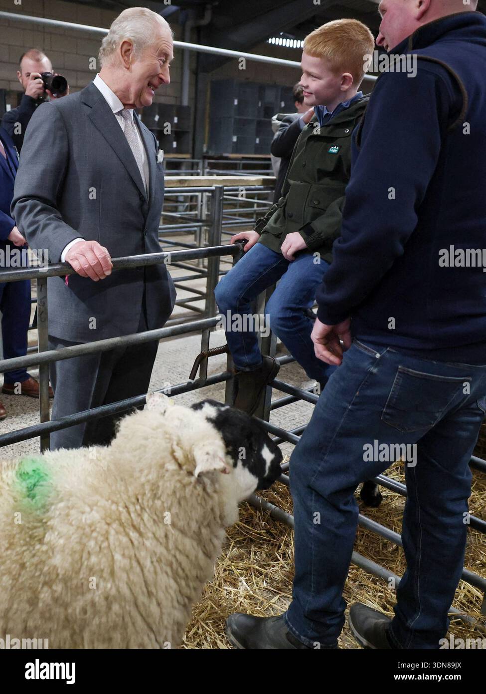 King Charles III meets Stanley Kempson, 8, on a tour of the livestock ...