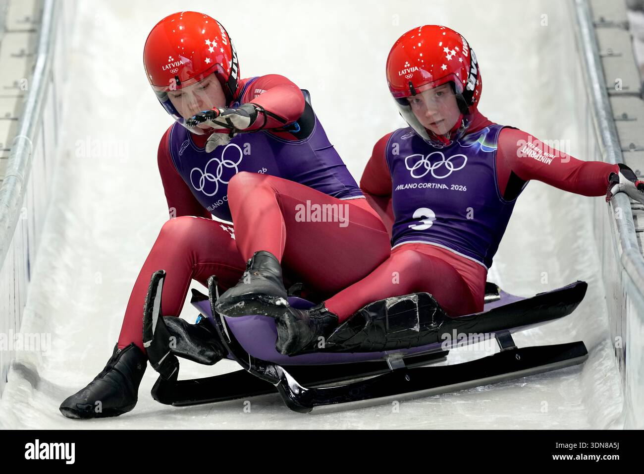Latvia's Marta Robezniece, left, and Kitija Bogdanova, right, arrive at ...
