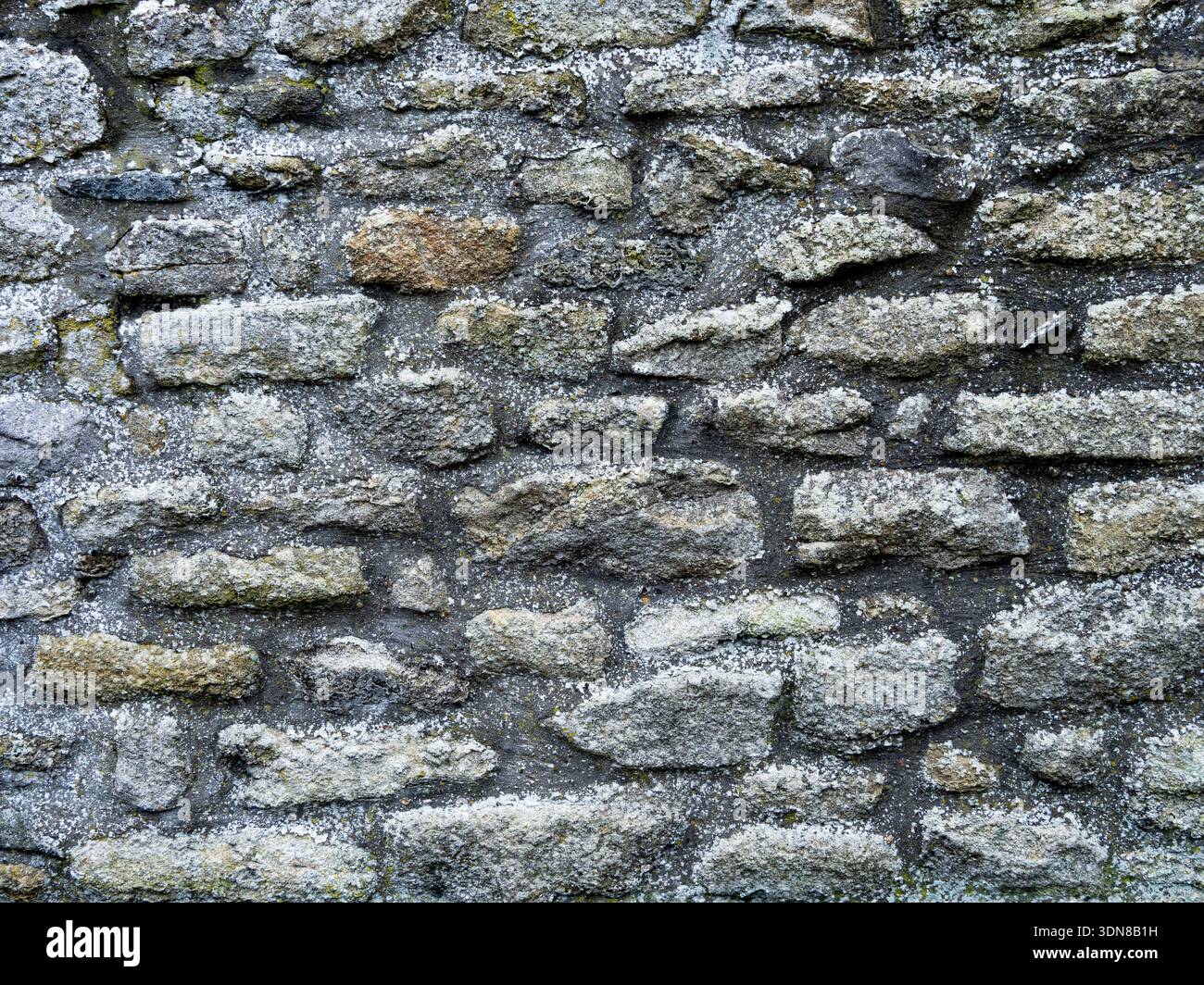 Grungy stone masonry forming a rough background surface Stock Photo - Alamy