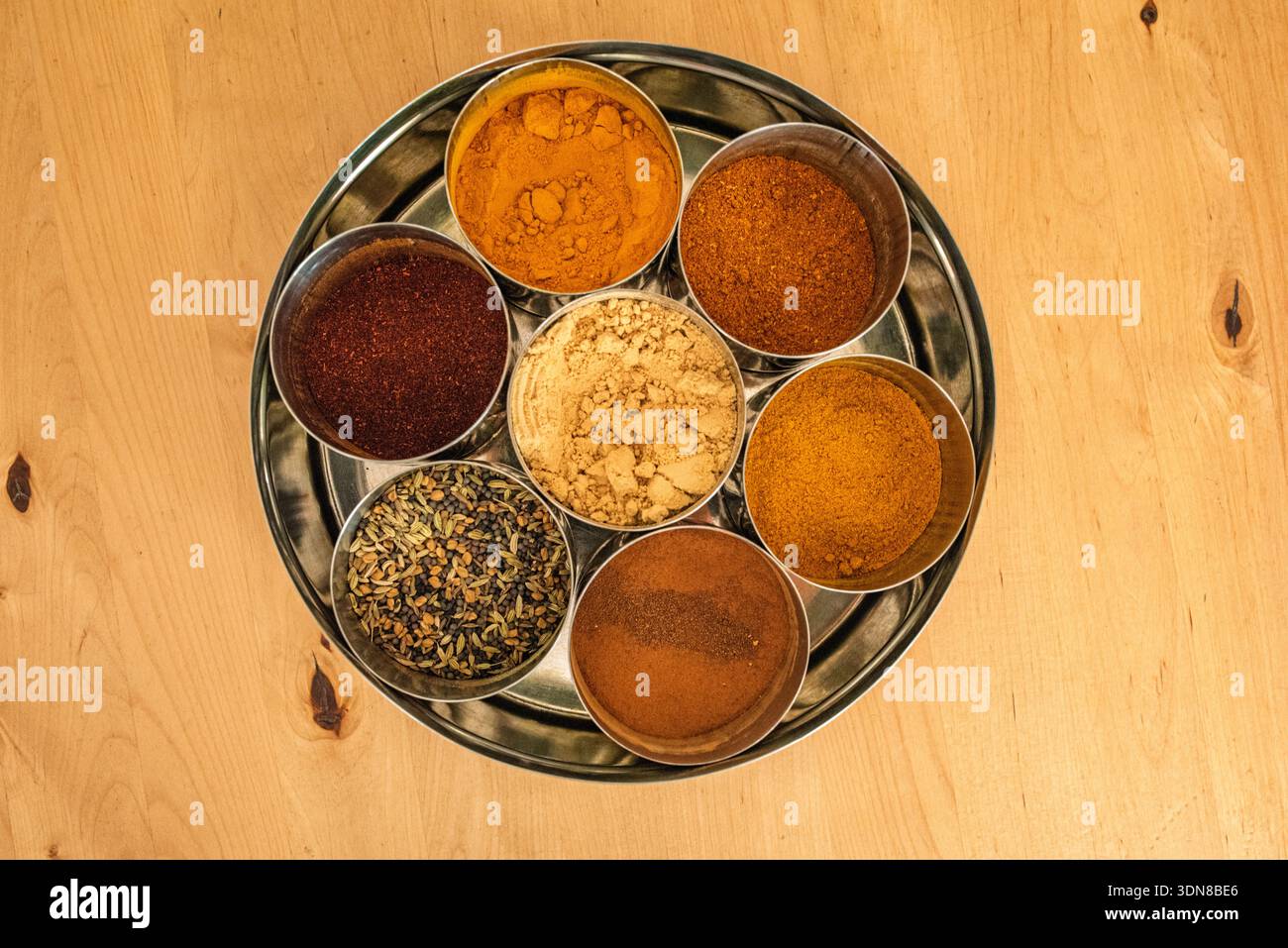 Masala Dabba, round stainless steel container with the essential spices ...