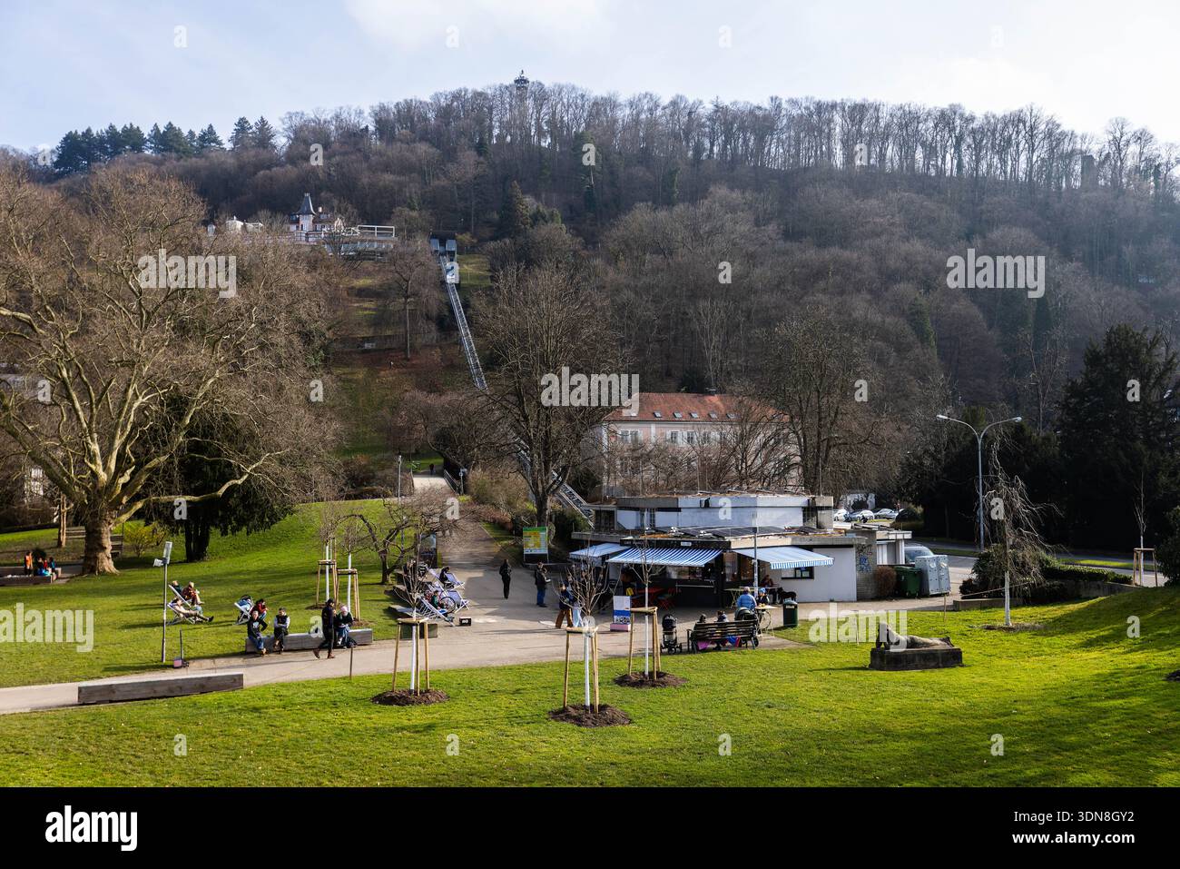 09 February 2026, Baden-Württemberg, Freiburg: People sit in front of a ...