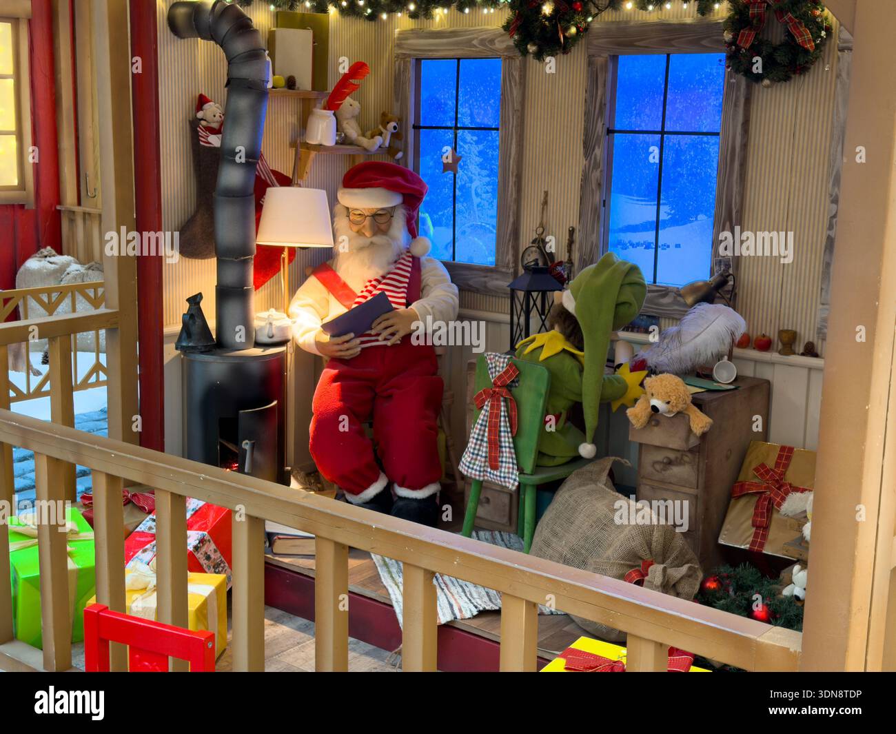An enchanting Christmas display portraying a Santa Claus figurine ...