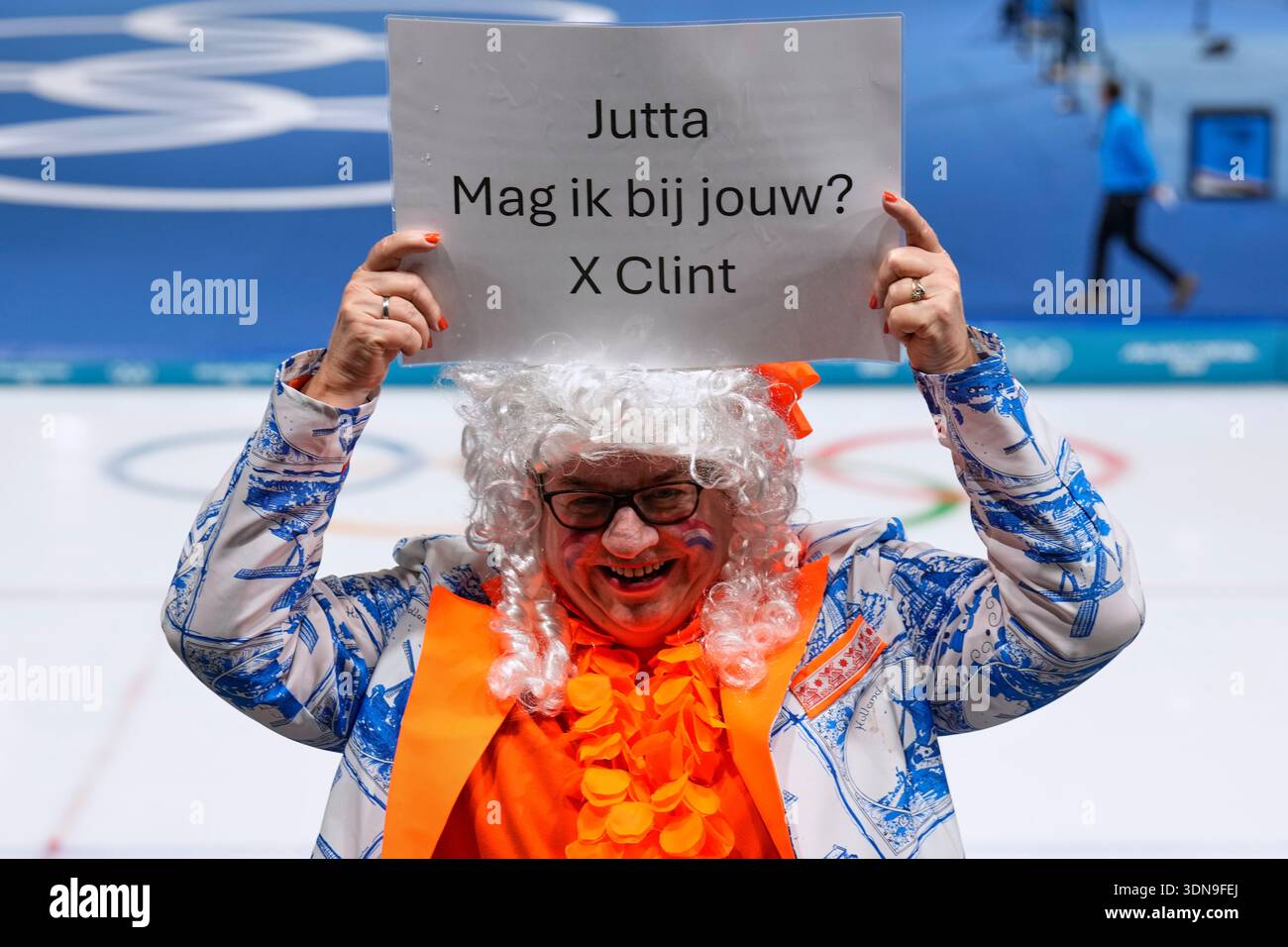 A dutch fan hols a sign reading "Jutta can I be with you?", referring ...