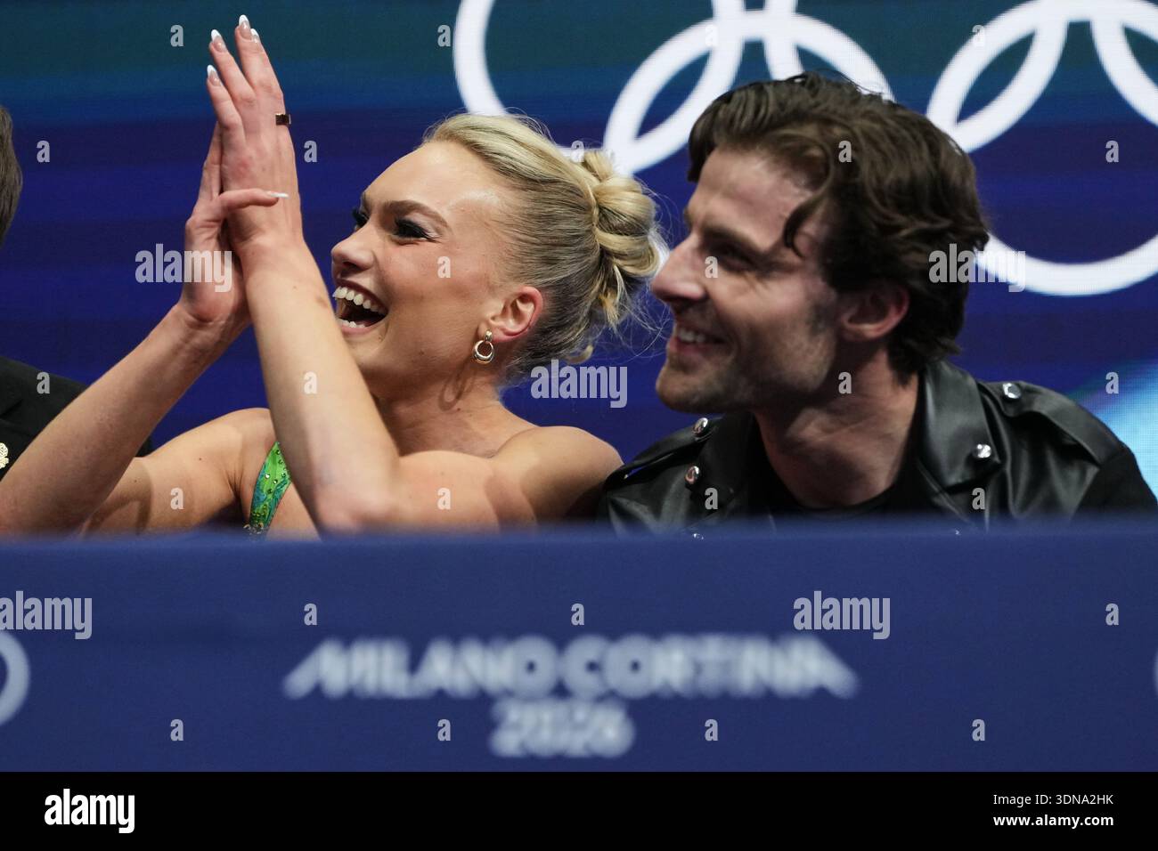 Phebe Bekker and James Hernandez of Britain react to their scores after ...