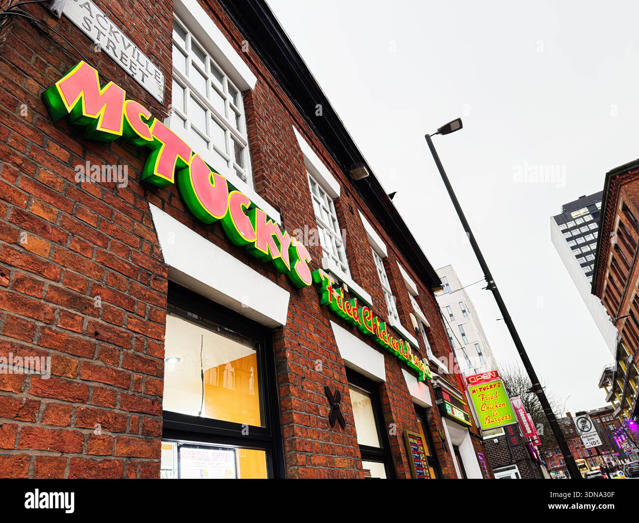 Manchester, UK - January 22, 2026: Vibrant urban McTucky's with neon ...