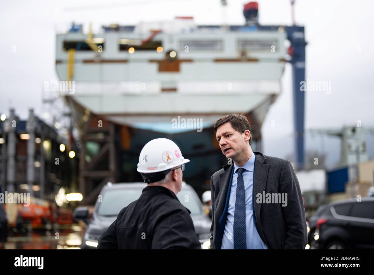 B.C. Premier David Eby, right, speaks with Seaspan CEO John McCarthy at ...