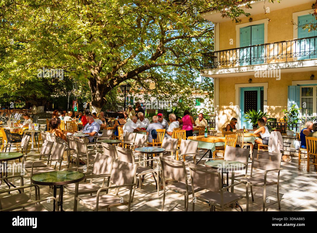 KARYA VILLAGE, LEFKADA ISLAND -SEP 25, 2025: People sitting in Greek ...