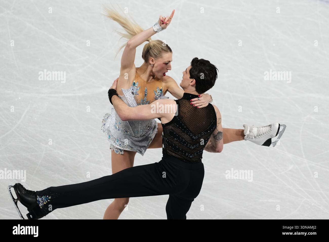 Piper Gilles and Paul Poirier of Canada compete during the rhythm dance ...