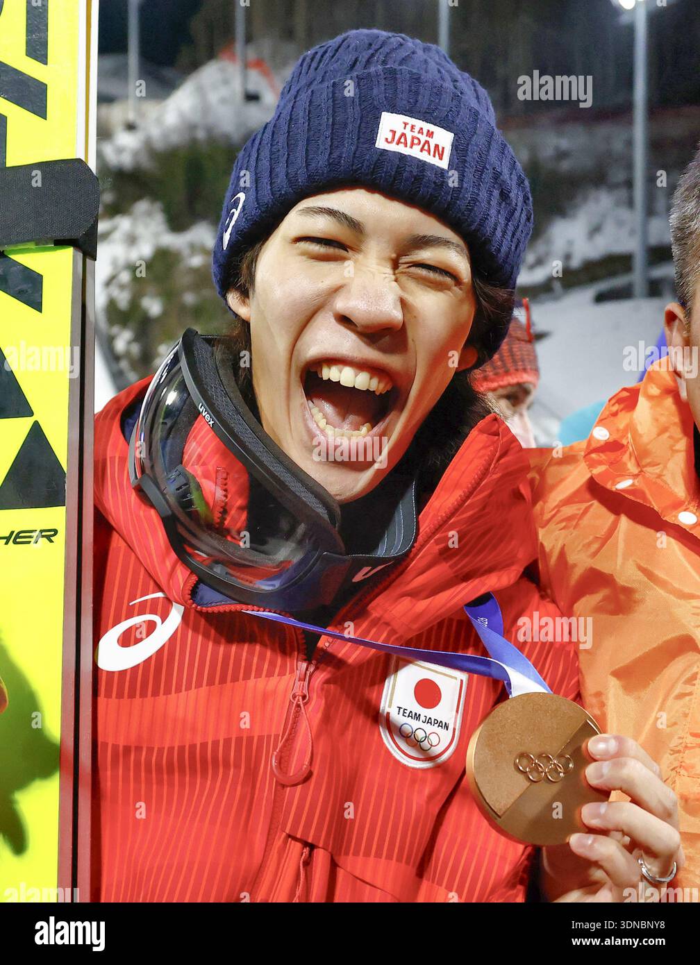 Japanese ski jumper Ren Nikaido celebrates after claiming the bronze ...