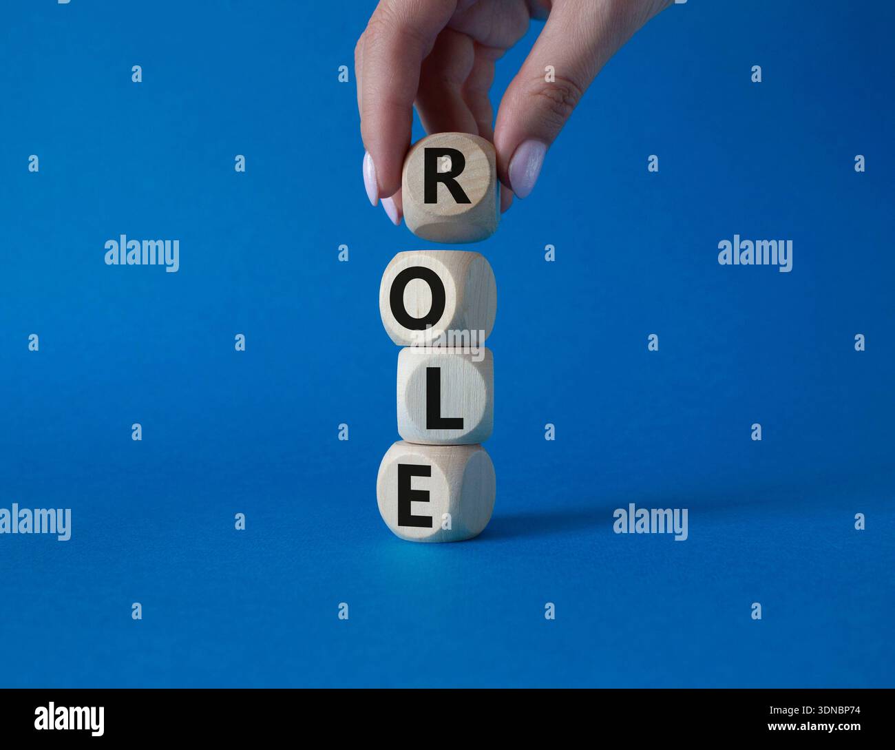 Role symbol. Concept word Role on wooden cubes. Businessman hand ...