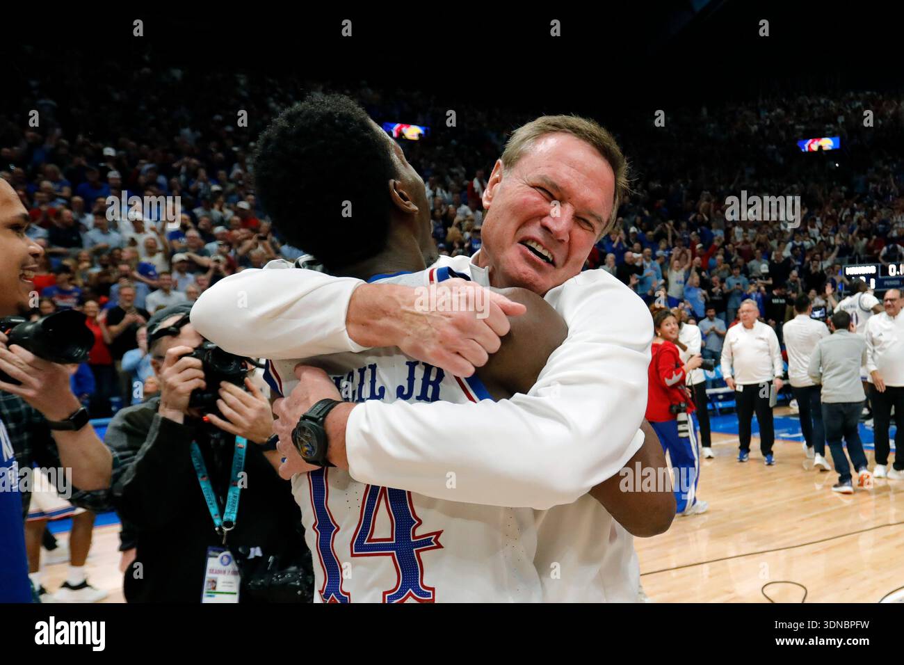 Kansas guard Melvin Council Jr. (14) is hugged by Kansas head coach ...