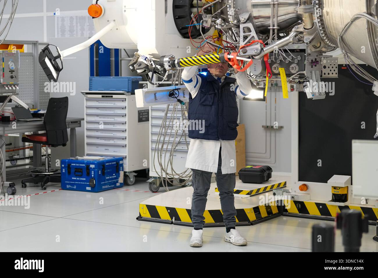 A mechanic works on the Vulcain 2.1 engine that powers the Ariane 64 ...