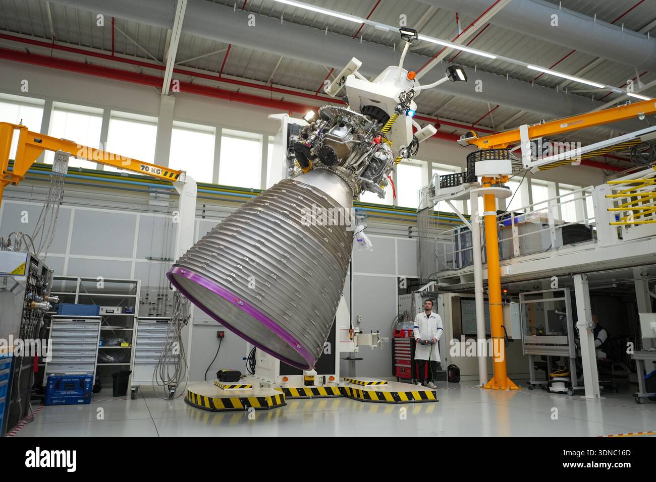 A mechanic works on the Vulcain 2.1 engine that powers the Ariane 64 ...